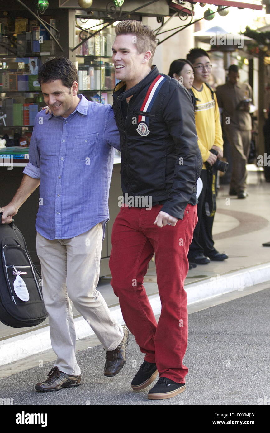 Sugar Ray's lead singer Mark McGrath seen carrying a guitar case and on ...