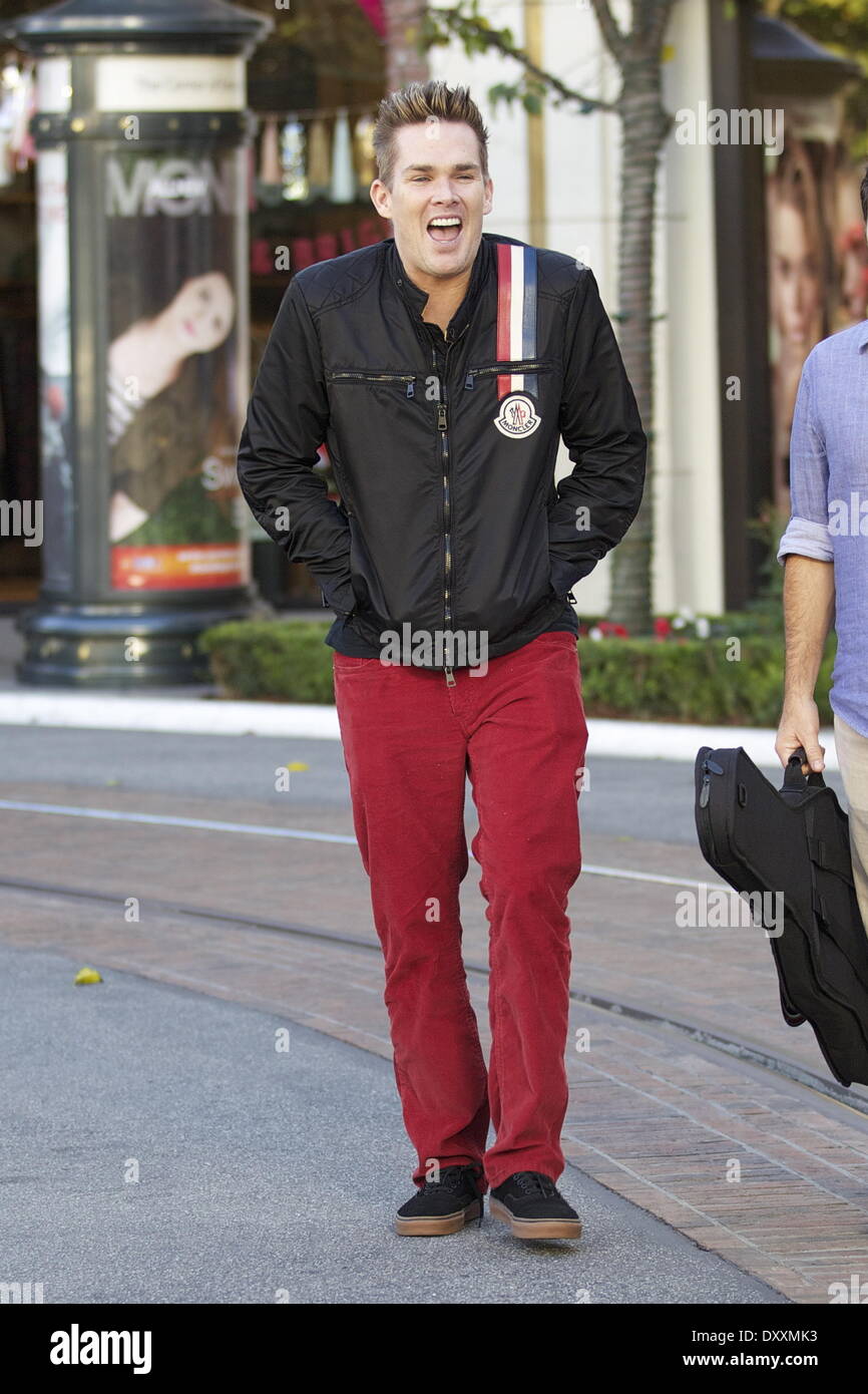 Sugar Ray's lead singer Mark McGrath seen carrying a guitar case and on ...