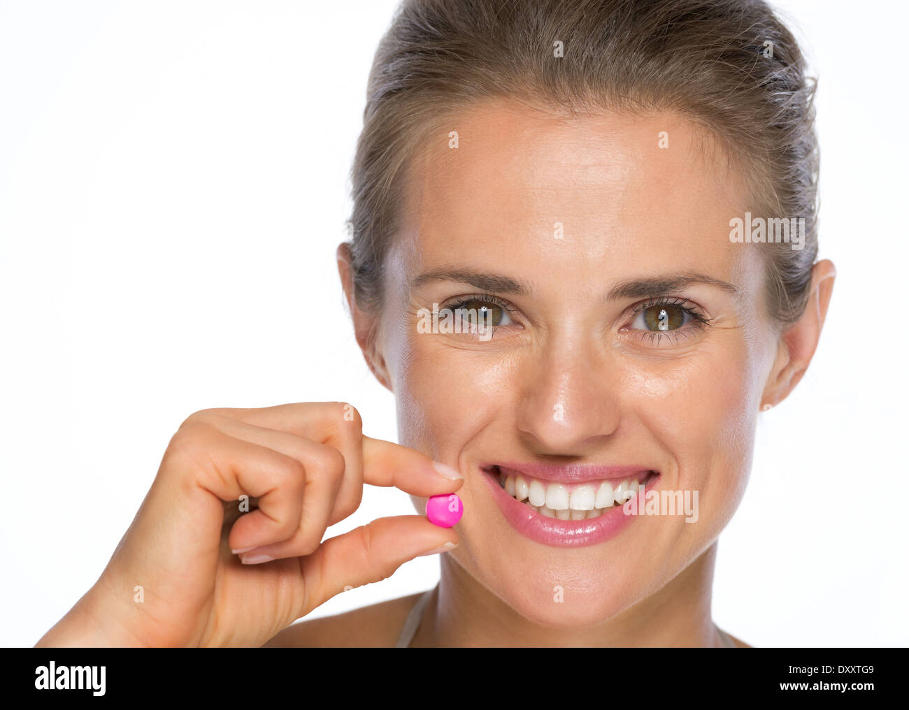 Portrait of happy young woman with pill Stock Photo - Alamy