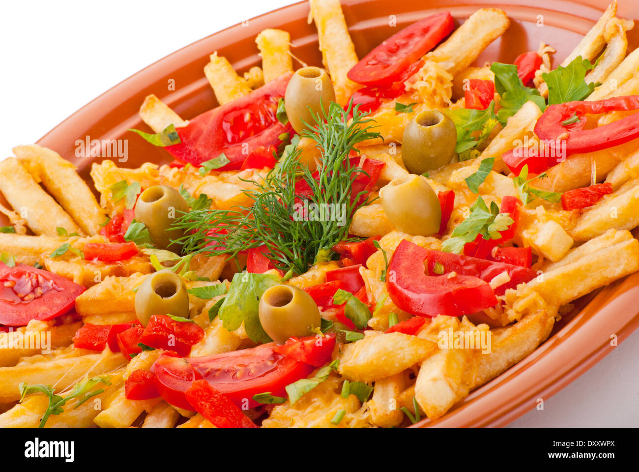 golden French fries potatoes with tomato and olive on white background ...