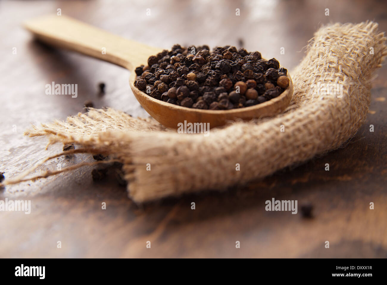 Pepper in an old wooden spoon. Spices. Pepper Stock Photo - Alamy
