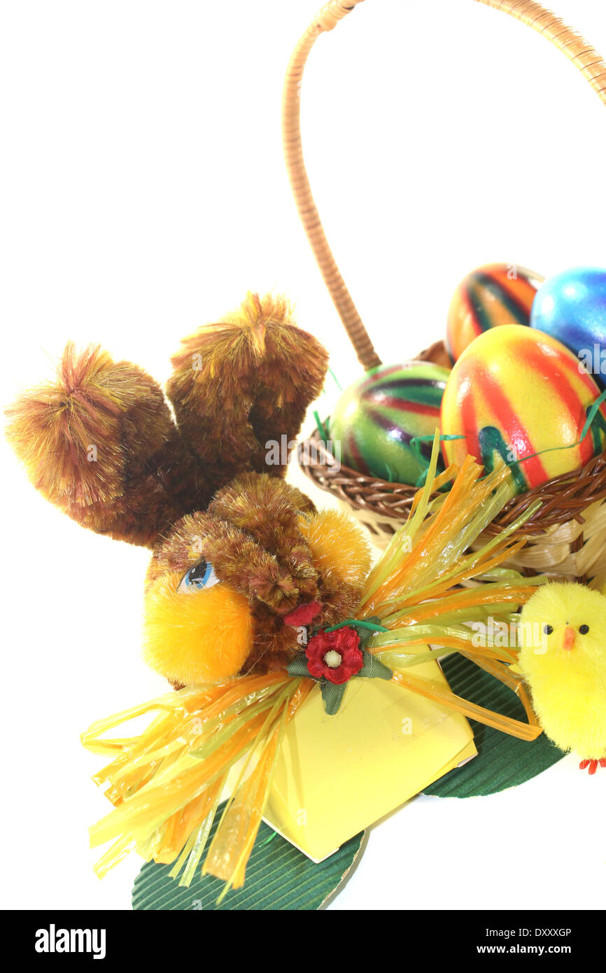 Easter Basket with chick, eggs and bunny on a light background Stock ...