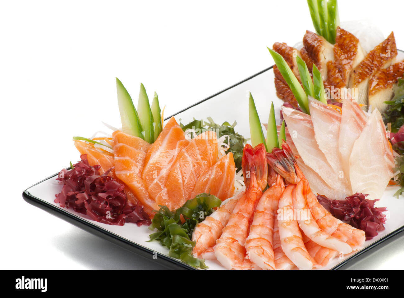 Set of Sashimi on Daikon (White Radish). Garnished with Ginger, Seaweed ...