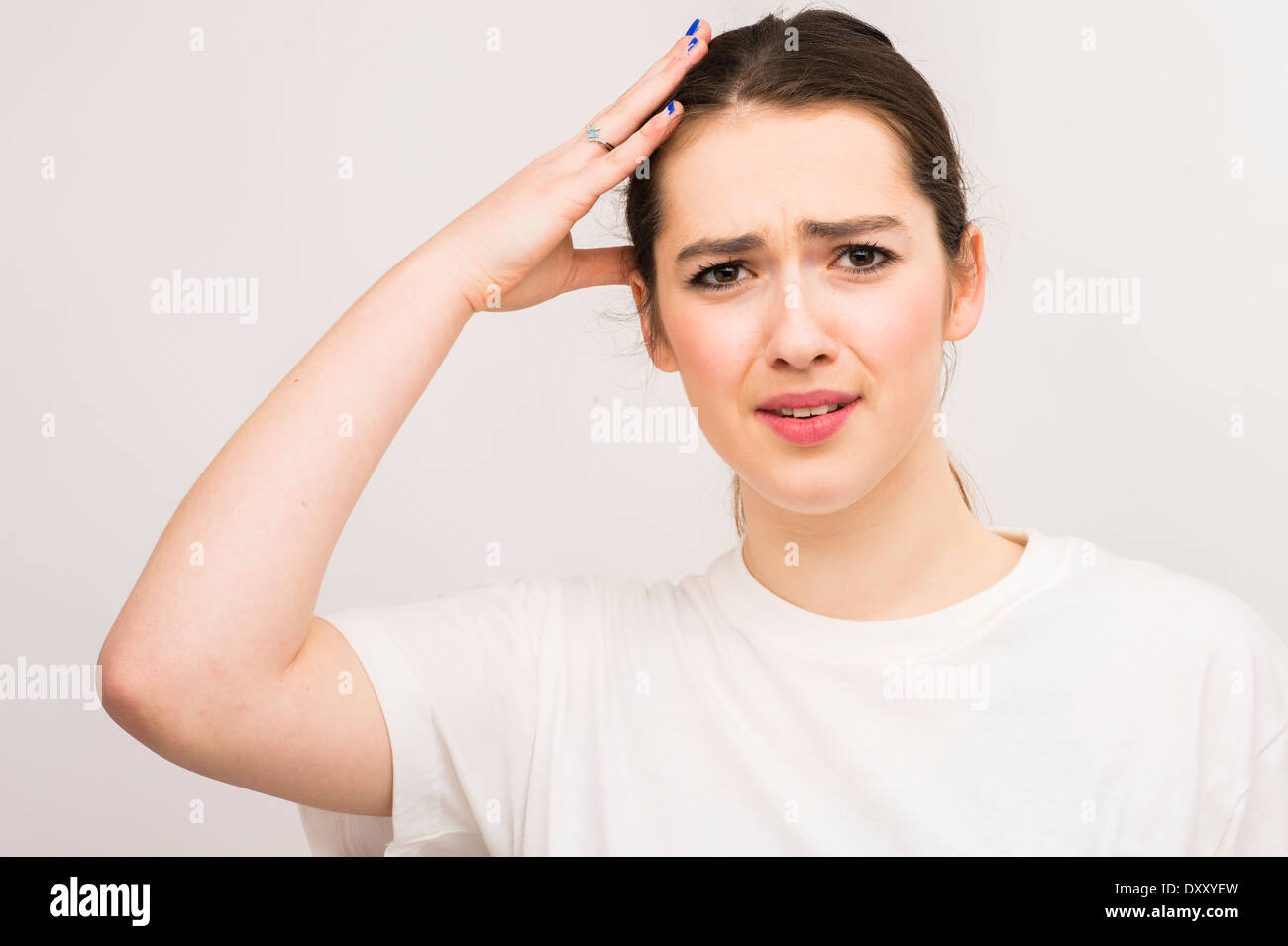 A young attractive slim caucasian woman girl, looking worried upset ...