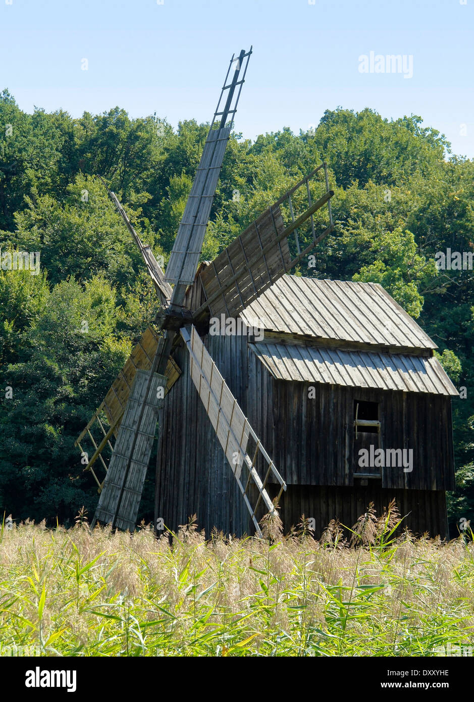 historic wooden wind mill in Romania Stock Photo - Alamy