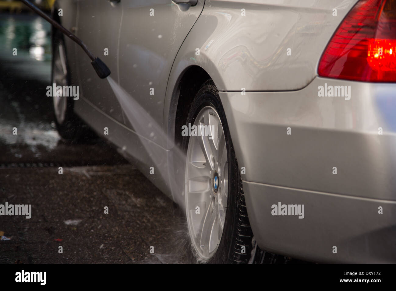 washing a car's wheel Stock Photo - Alamy