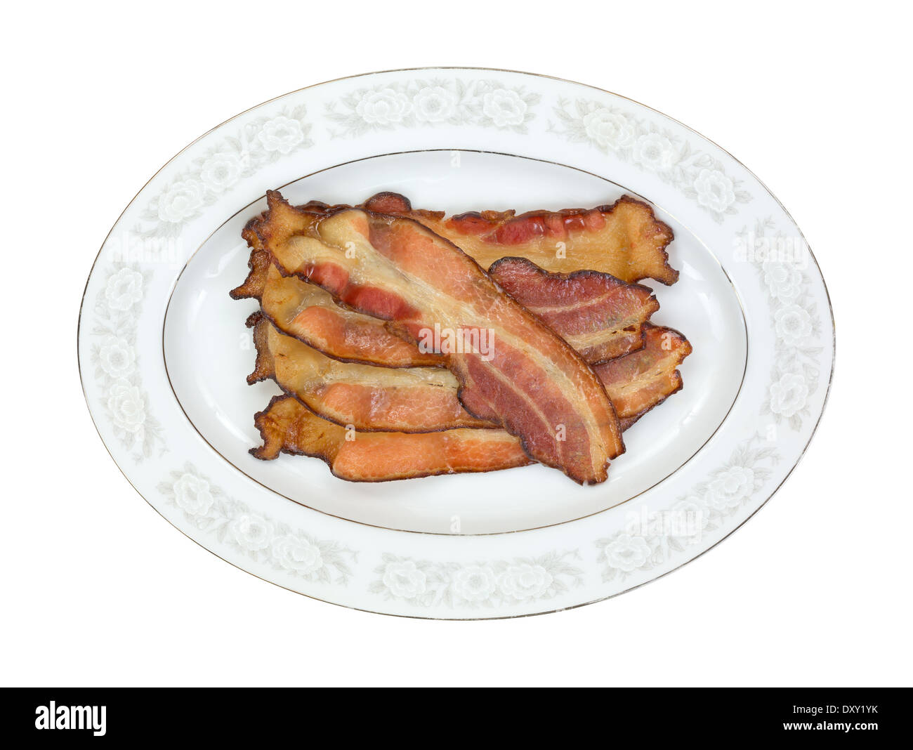 Top view of freshly cooked smoked thick sliced bacon on an old glass ...