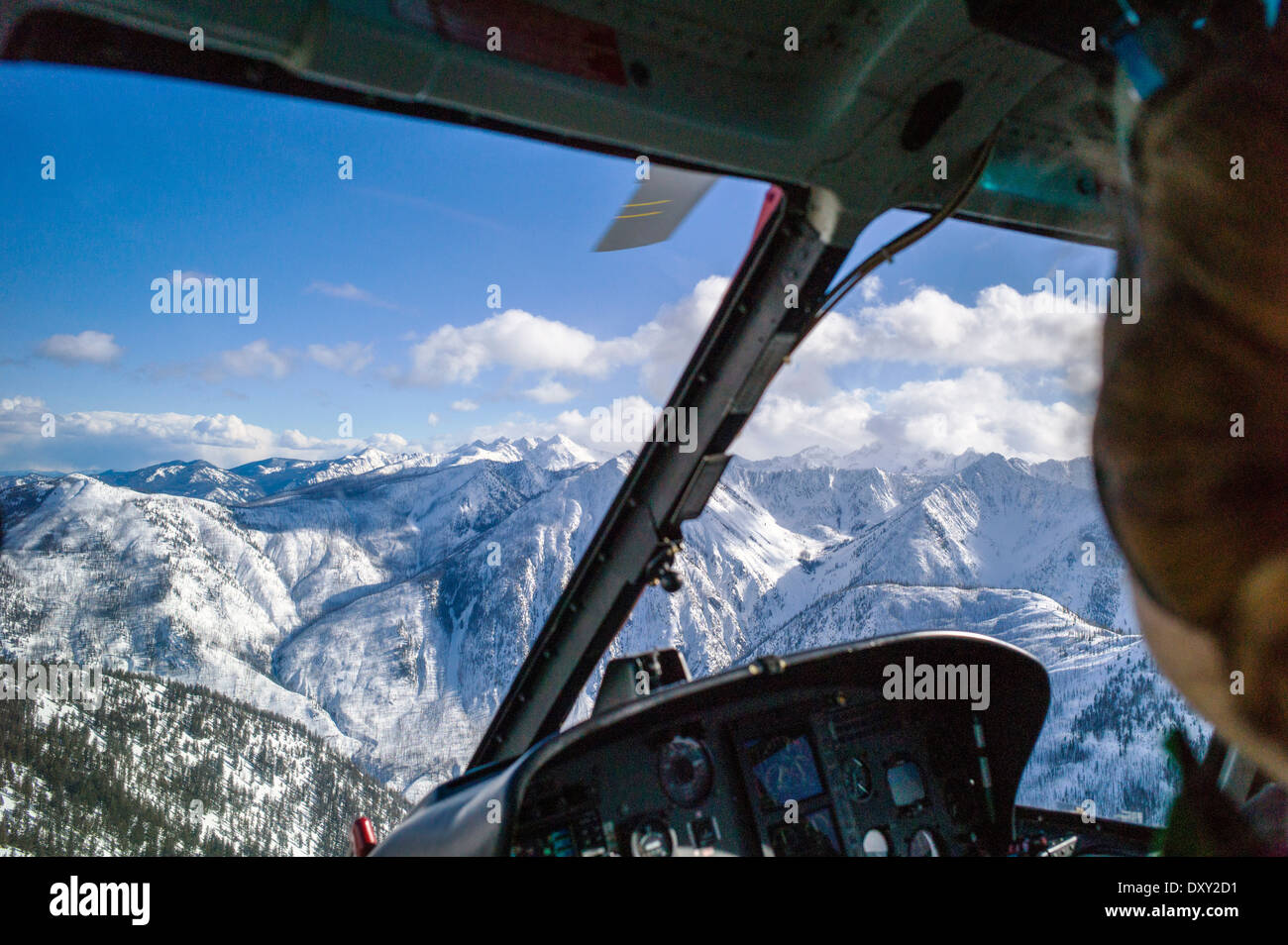 View from helicopter flying back country skiers back from remote ...