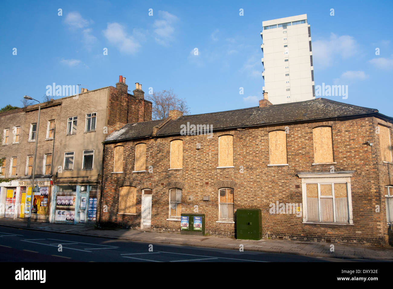 Row of brick terraced houses and former shop premises awaiting ...