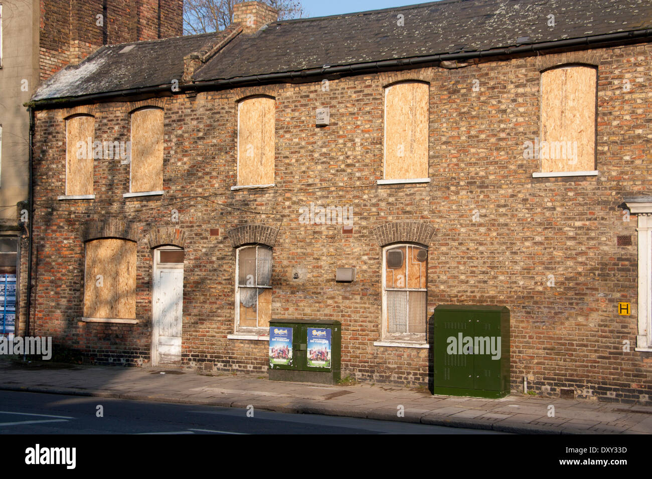 Row of brick terraced houses and former shop premises awaiting ...