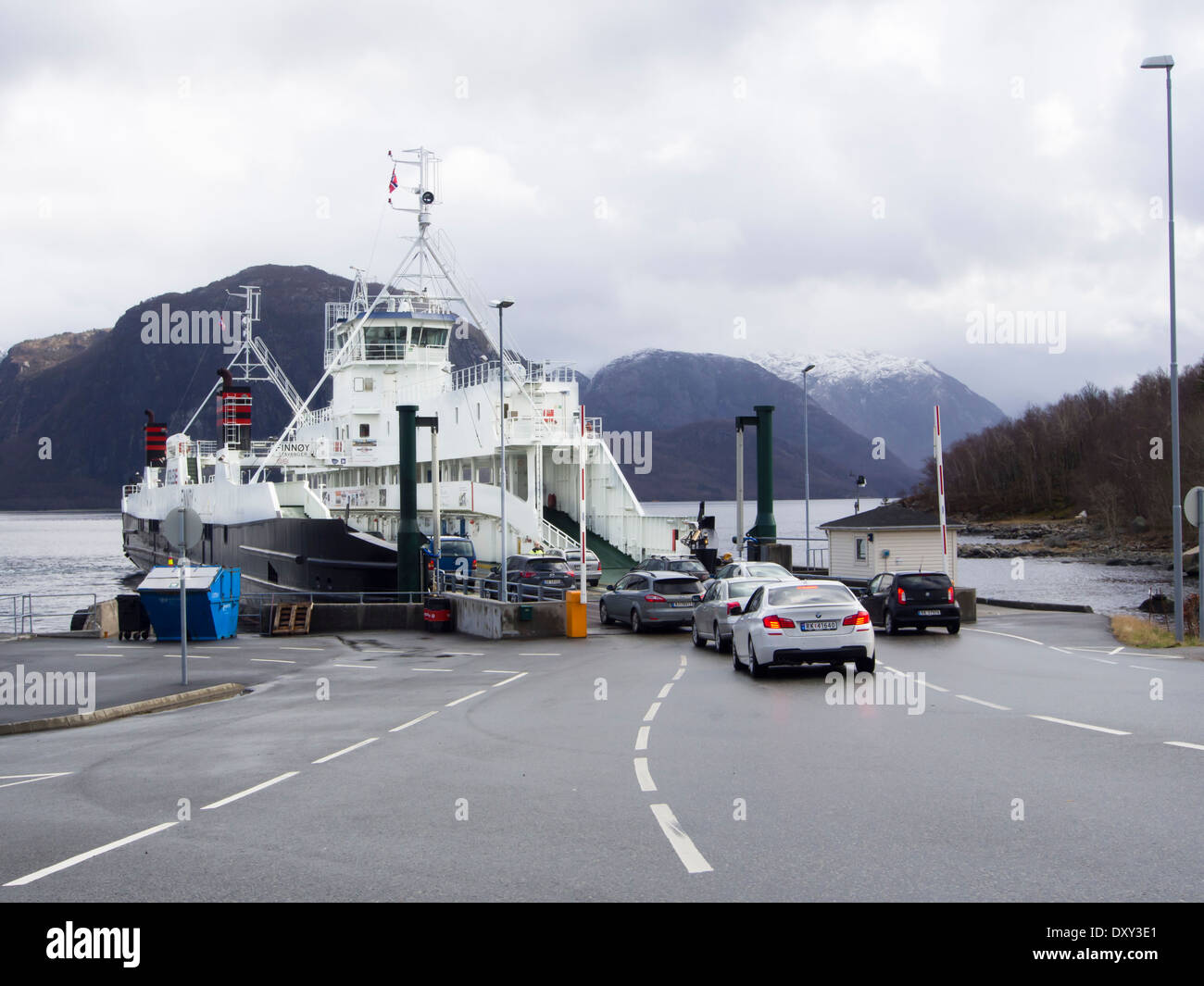 Cars driving on board ferry ready to leave Lauvvik ferry port in ...