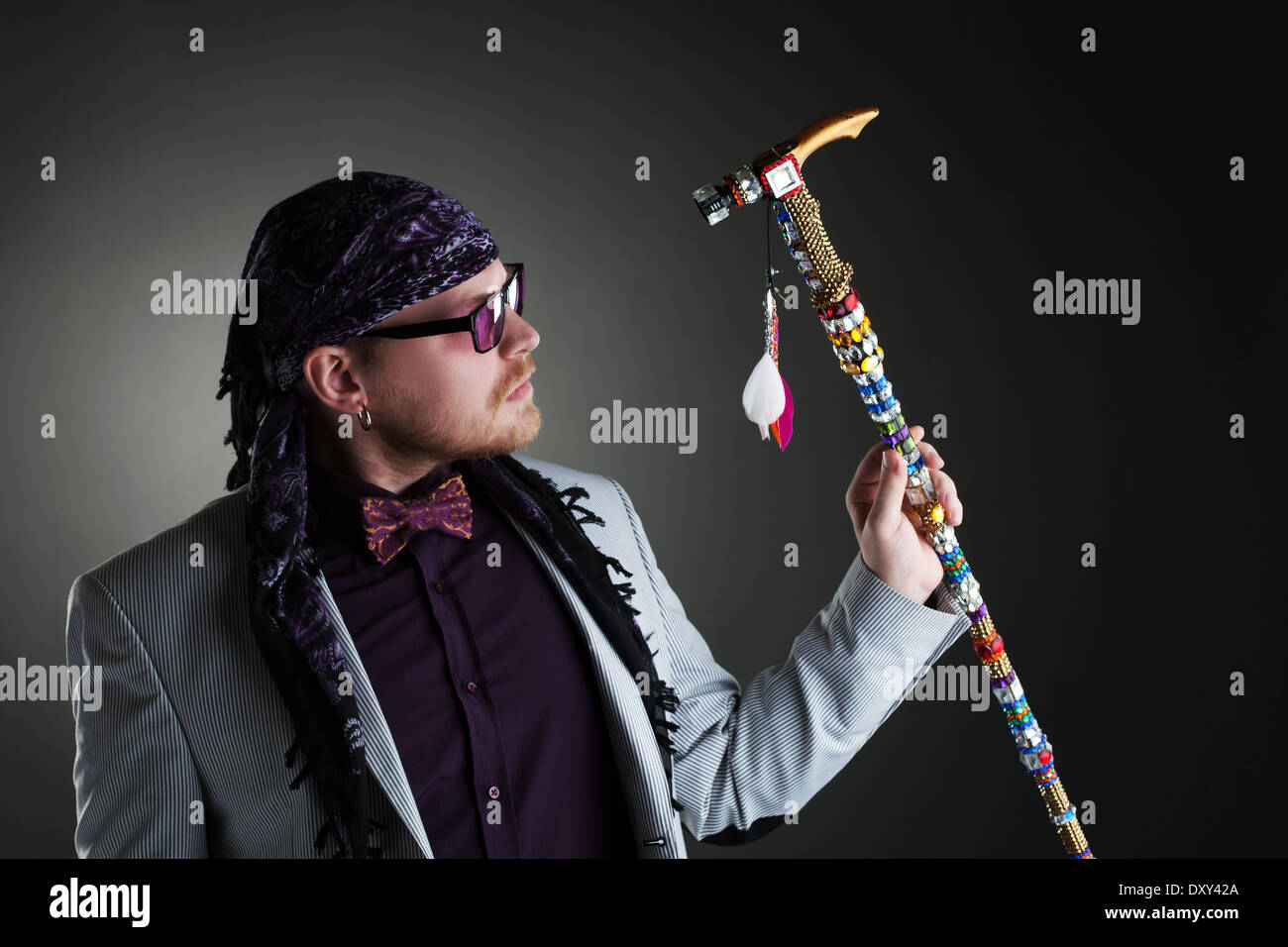 Shot of middle-aged man posing with decorated cane Stock Photo - Alamy