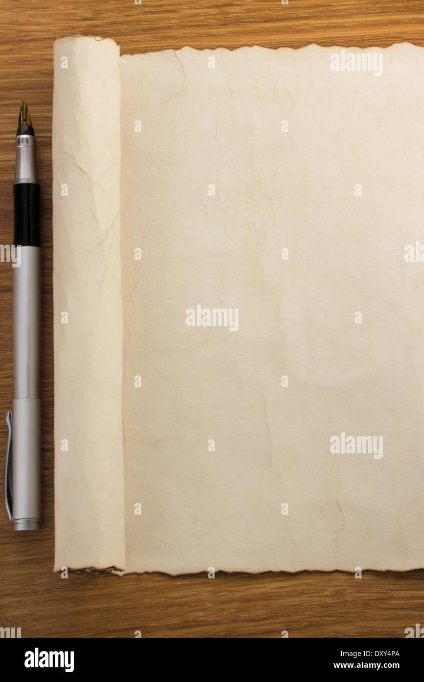 parchment scroll on wooden background Stock Photo - Alamy