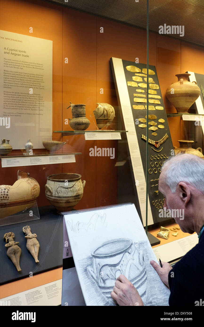 An elderly man designs ancient objects in British Museum, London Stock ...