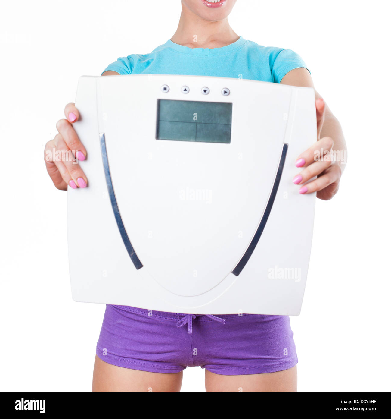 Diet and sport concept - young sporty woman shows scale on white Stock ...