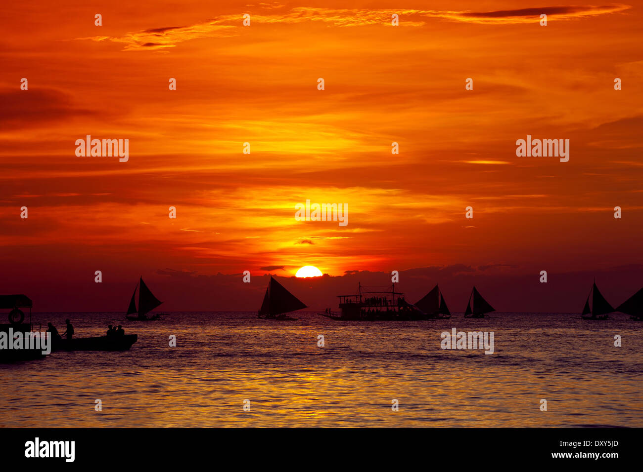 Beautiful sunset on beach boats hi-res stock photography and images - Alamy