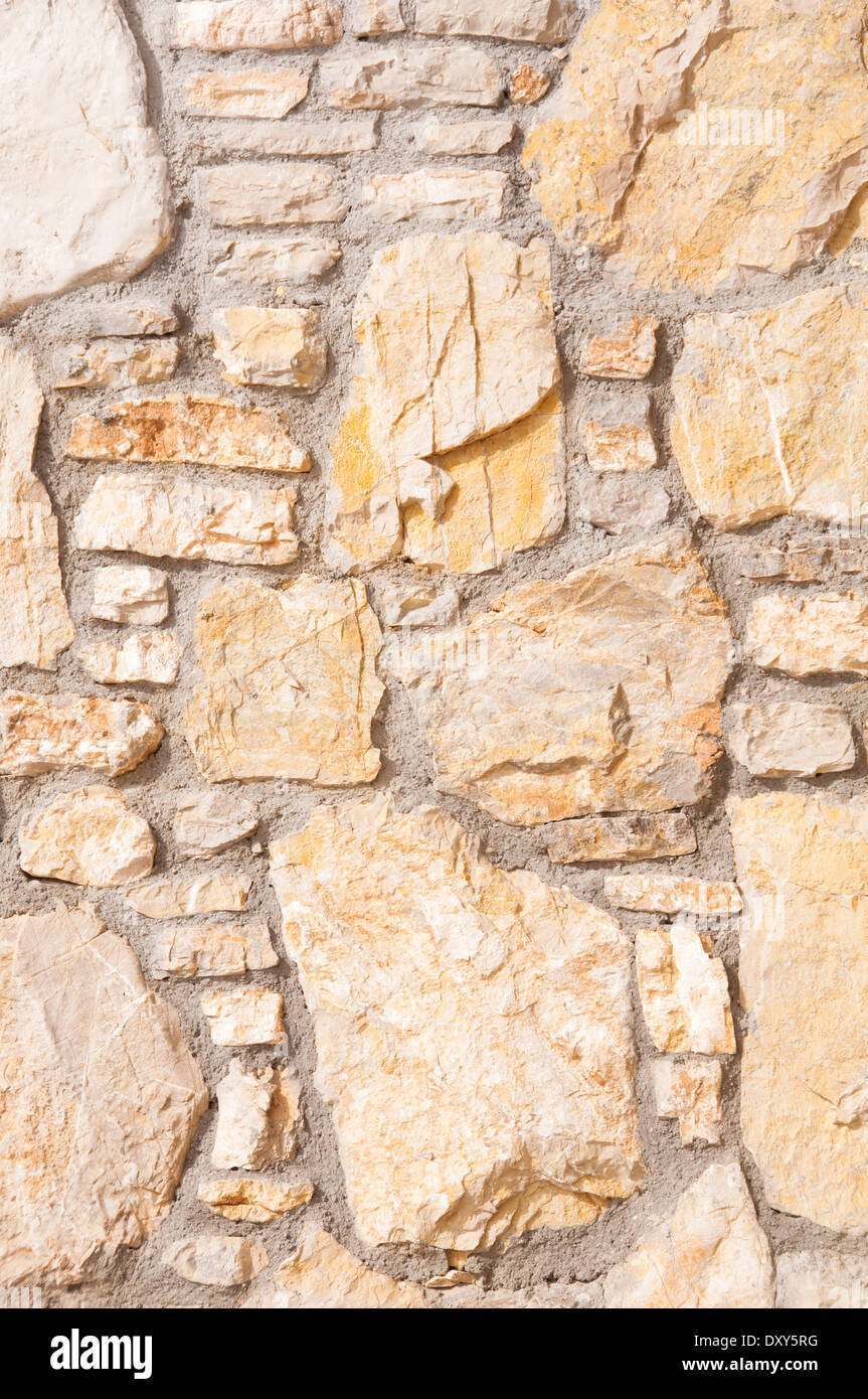 Vertical stone background wall of stonework Stock Photo - Alamy