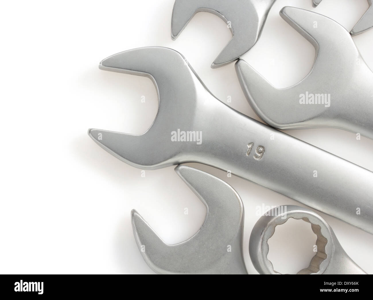 wrench tool and nut isolated on white background Stock Photo - Alamy