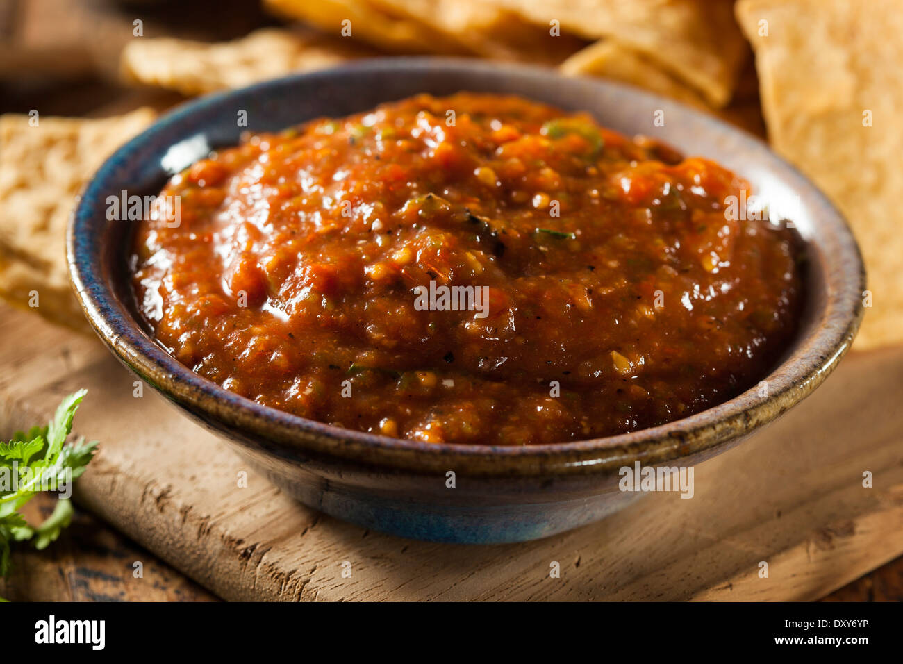 Organic Red Spicy Salsa with Tortilla Chips Stock Photo - Alamy