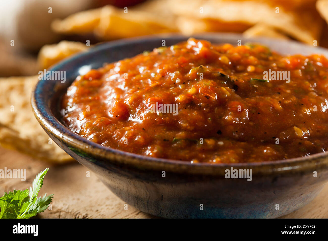 Organic Red Spicy Salsa with Tortilla Chips Stock Photo - Alamy