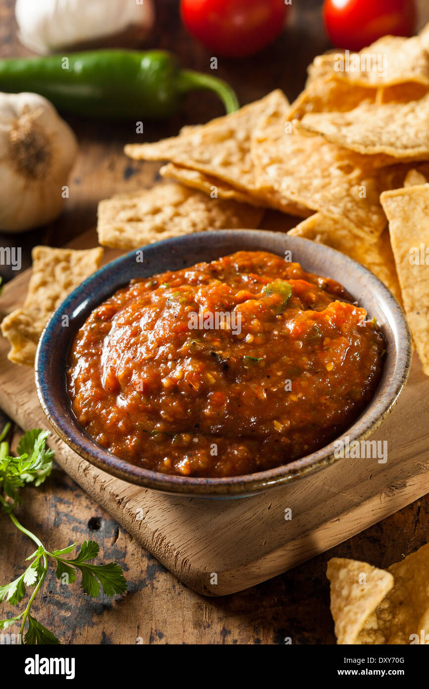Organic Red Spicy Salsa with Tortilla Chips Stock Photo - Alamy