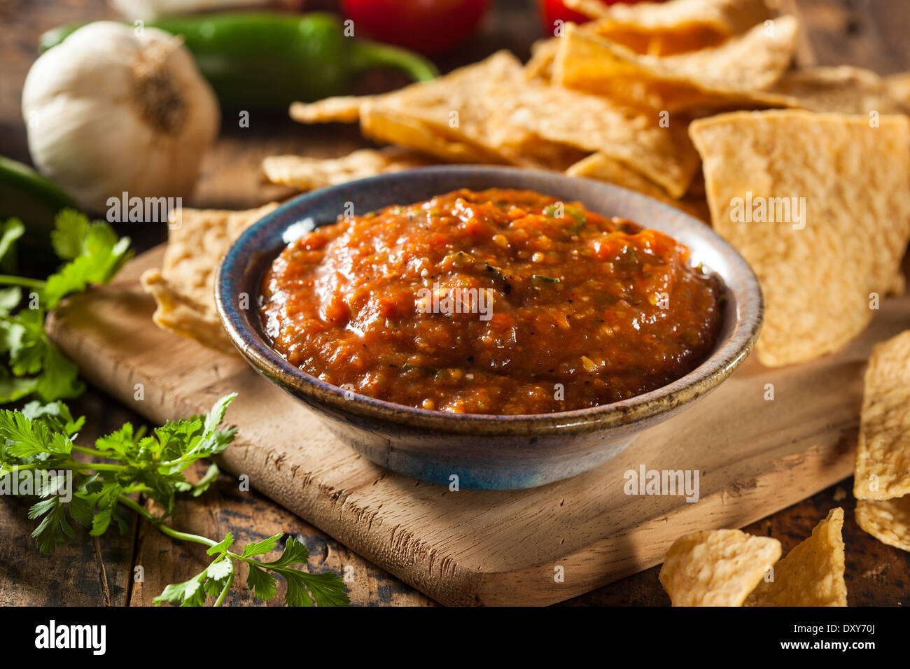 Organic Red Spicy Salsa with Tortilla Chips Stock Photo - Alamy