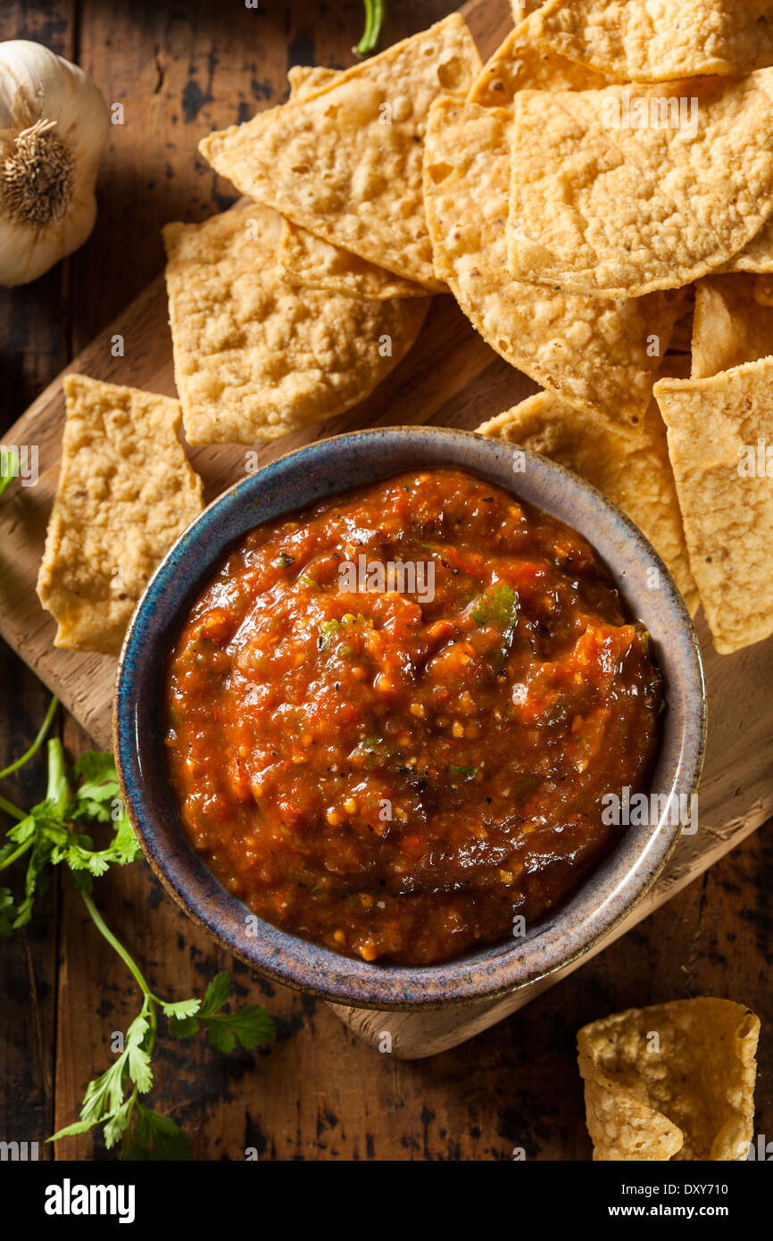 Organic Red Spicy Salsa with Tortilla Chips Stock Photo - Alamy