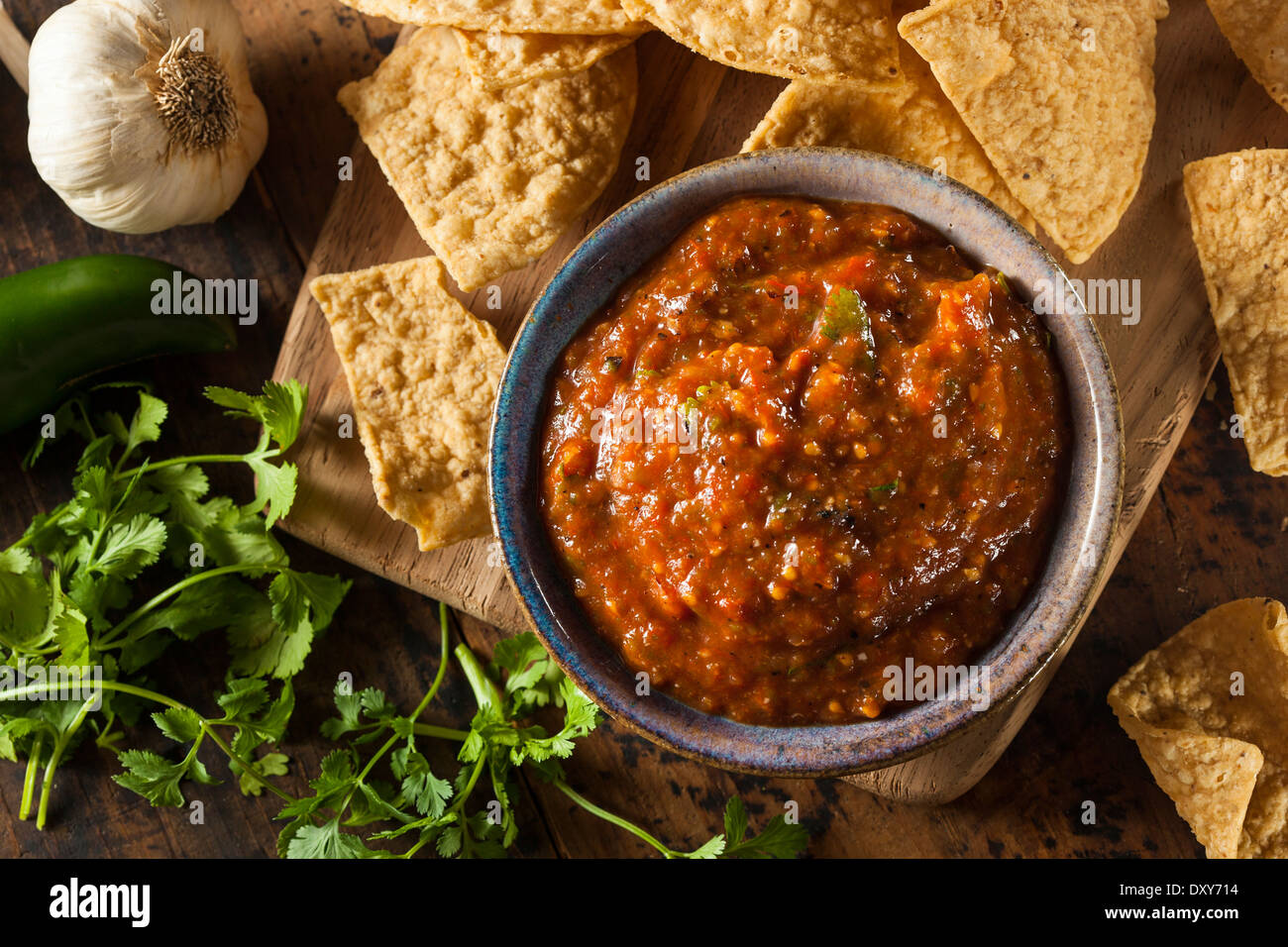 Organic Red Spicy Salsa with Tortilla Chips Stock Photo - Alamy