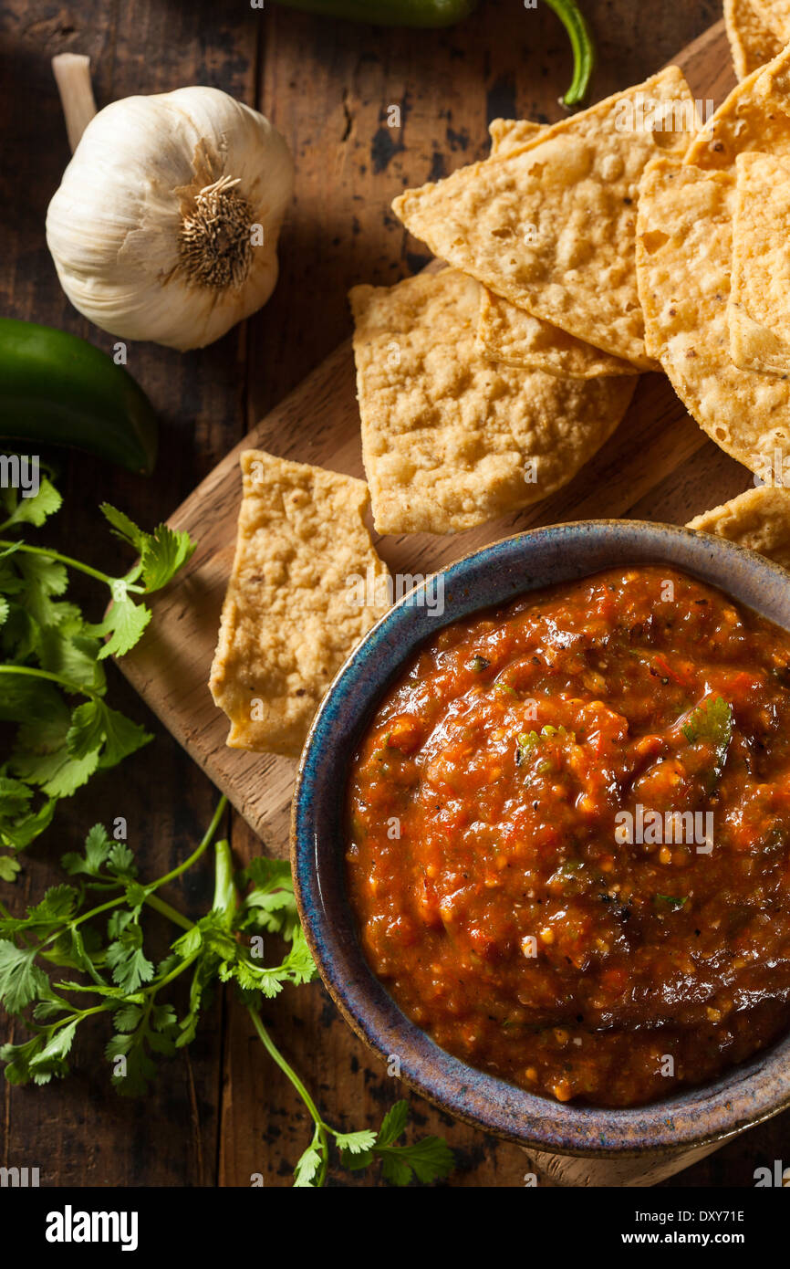 Organic Red Spicy Salsa with Tortilla Chips Stock Photo - Alamy