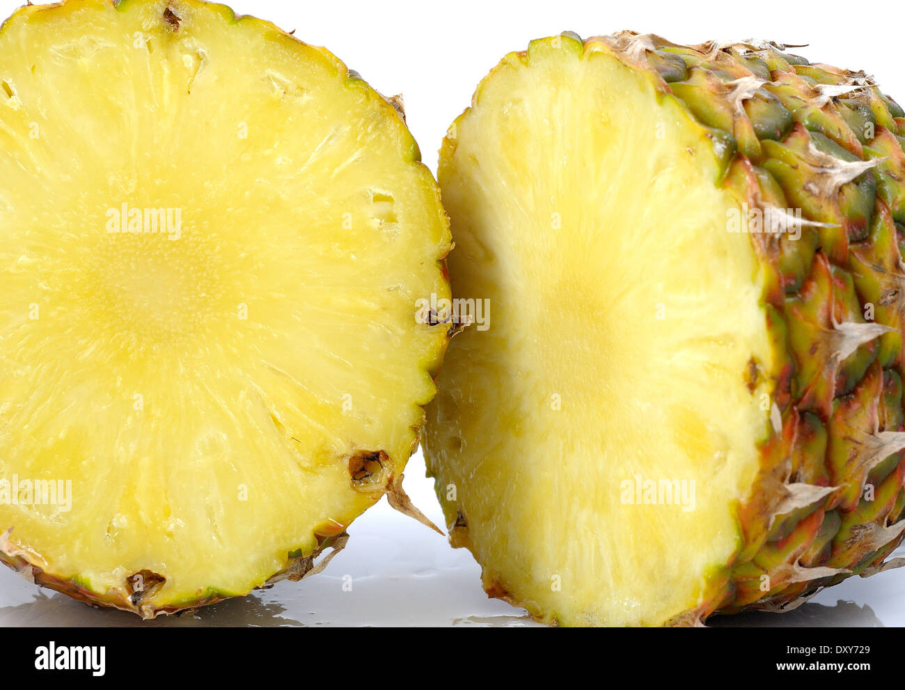 Pineapple cut in two Stock Photo - Alamy