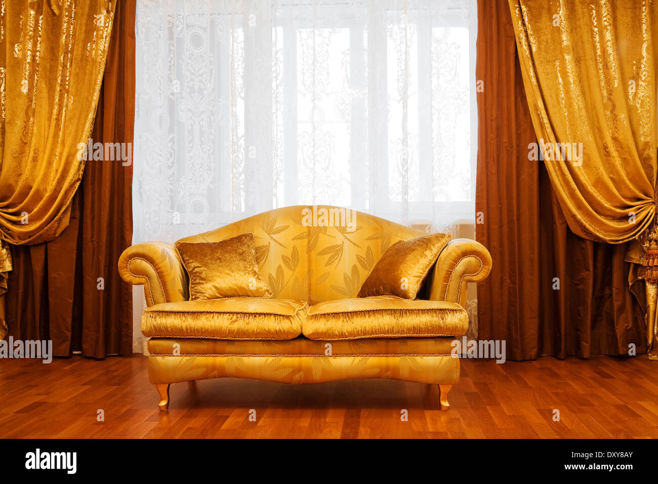 Beautiful sofa at a window in a modern apartment Stock Photo - Alamy
