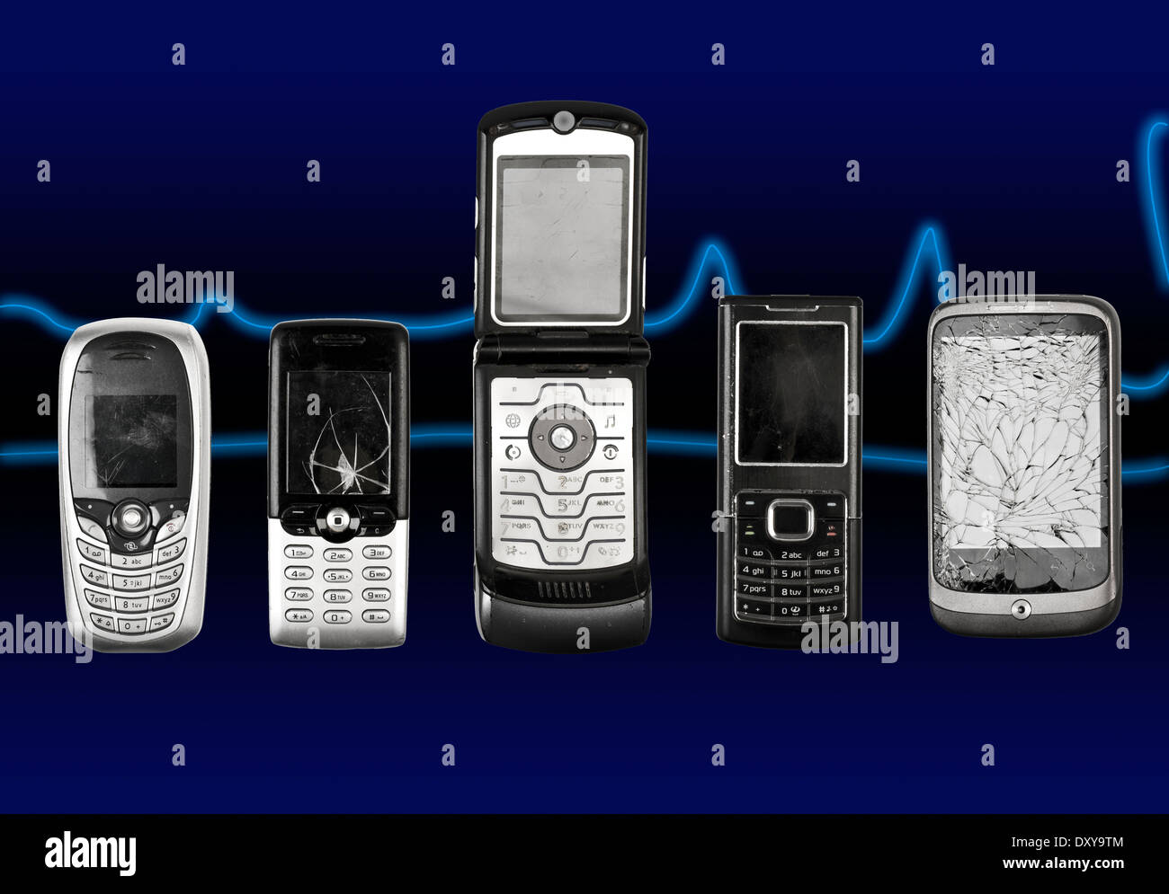 Old and Broken Mobile Phones on a Blue Background Stock Photo - Alamy