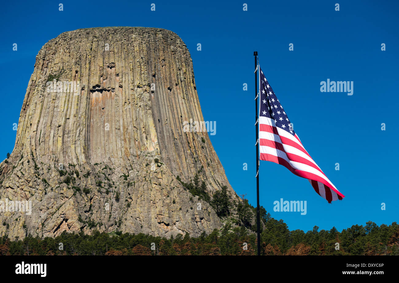Devil's Tower National Monument with US flag Stock Photo - Alamy