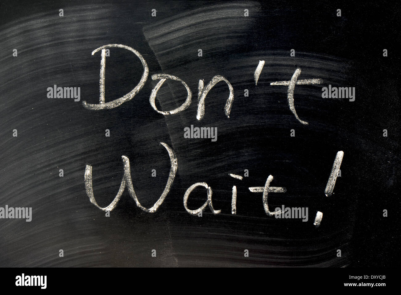 Don't Wait - words written with chalk on a blackboard Stock Photo - Alamy