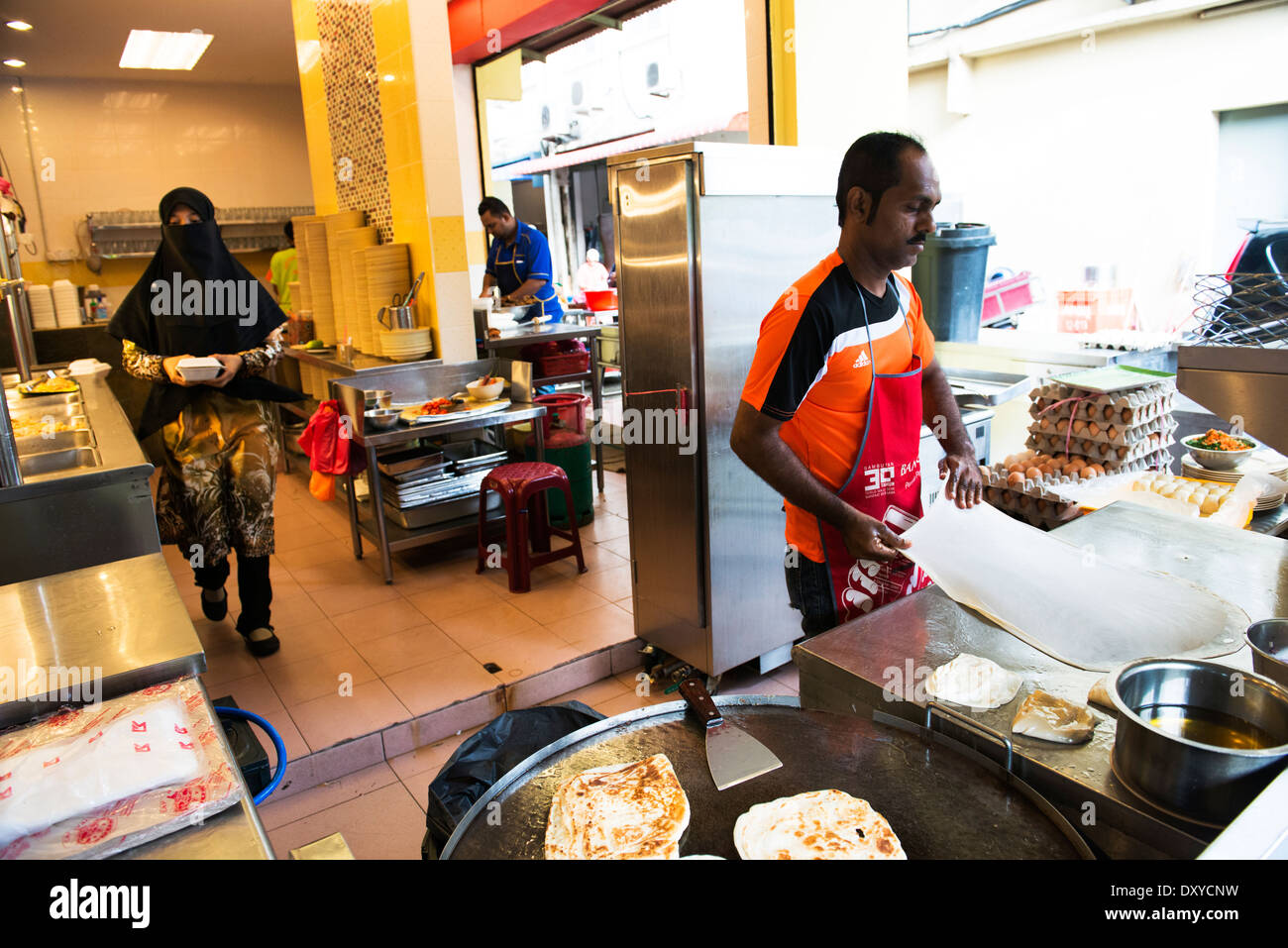 Roti preparations in a local Malay restaurant Stock Photo - Alamy