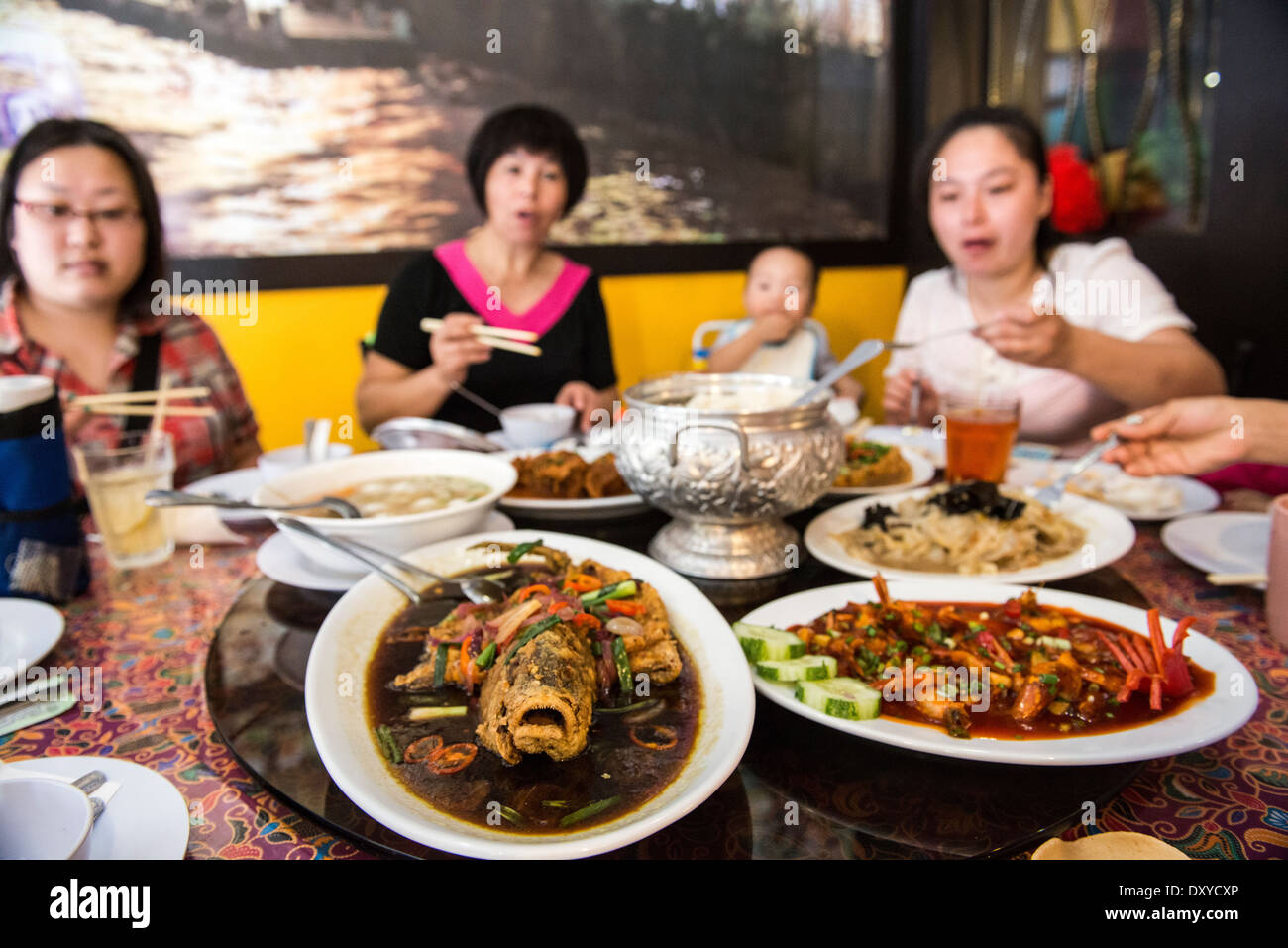 Enjoying variety of Nyonya cuisine dishes Stock Photo - Alamy