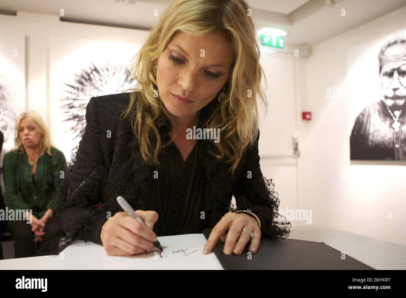 Kate Moss signs copies of "The Kate Moss Book" at Colette's store ...