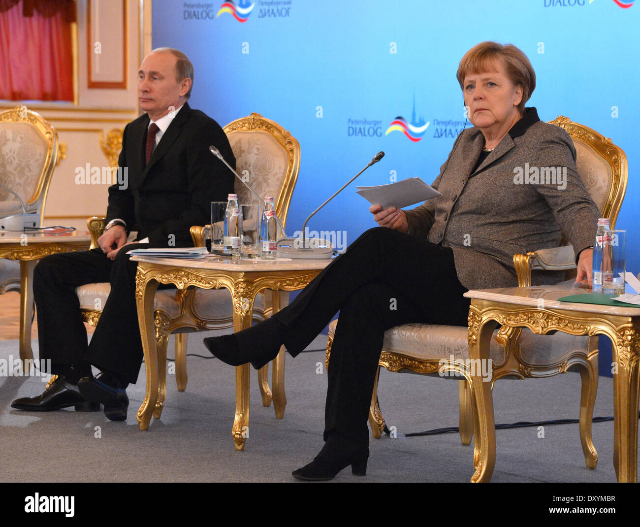 Russian President Vladimir Putin and German Chancellor Angela Merkel ...