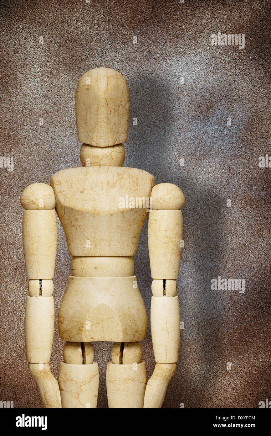 an old dummy in a wall background Stock Photo - Alamy