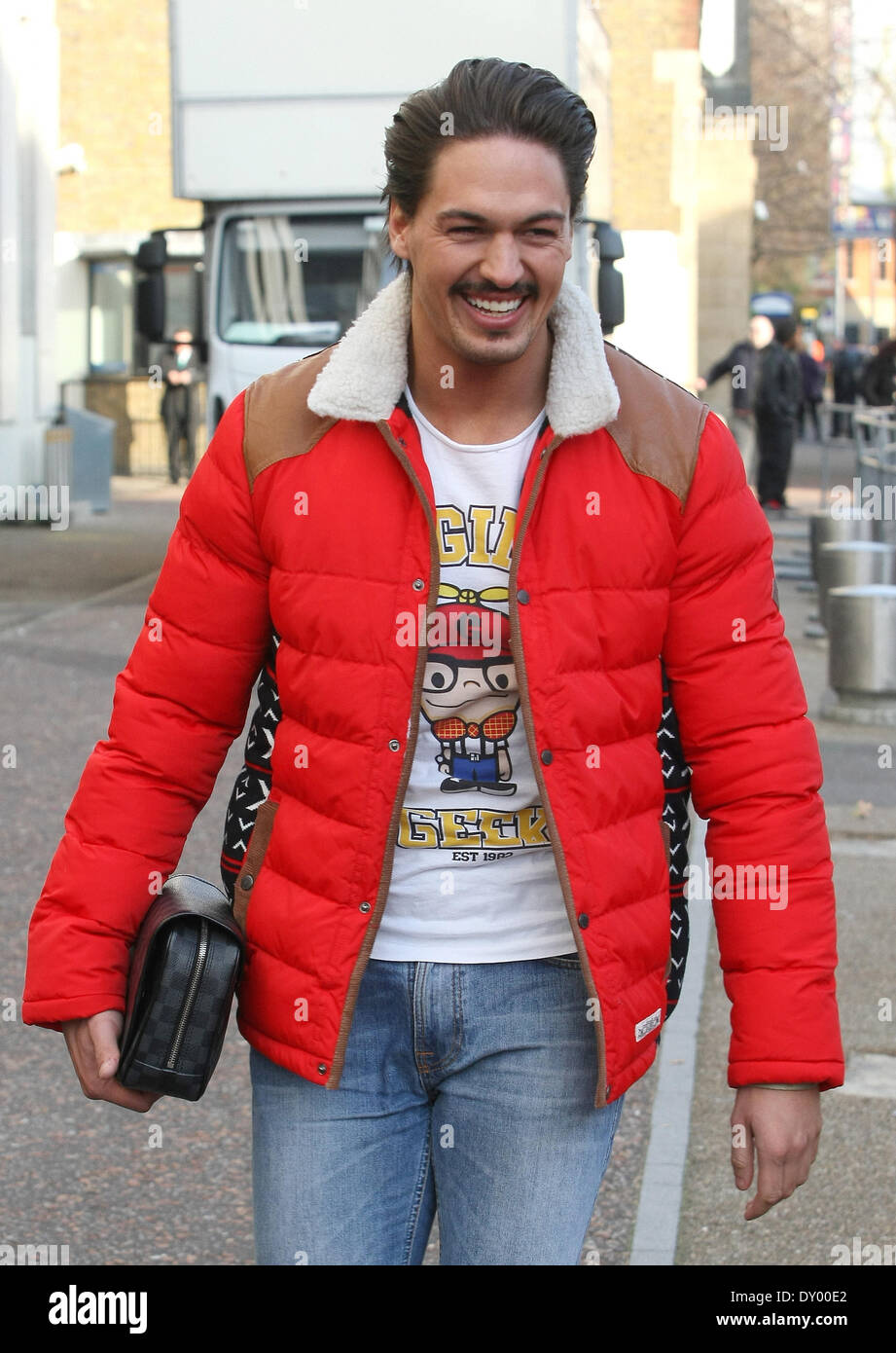 moustache facial hair red coat jeans Stock Photo - Alamy