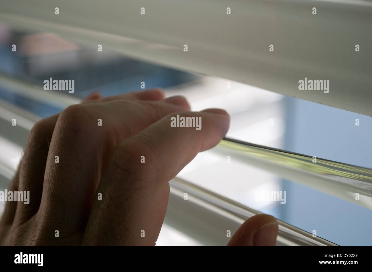 Man opening window blinds hi-res stock photography and images - Alamy