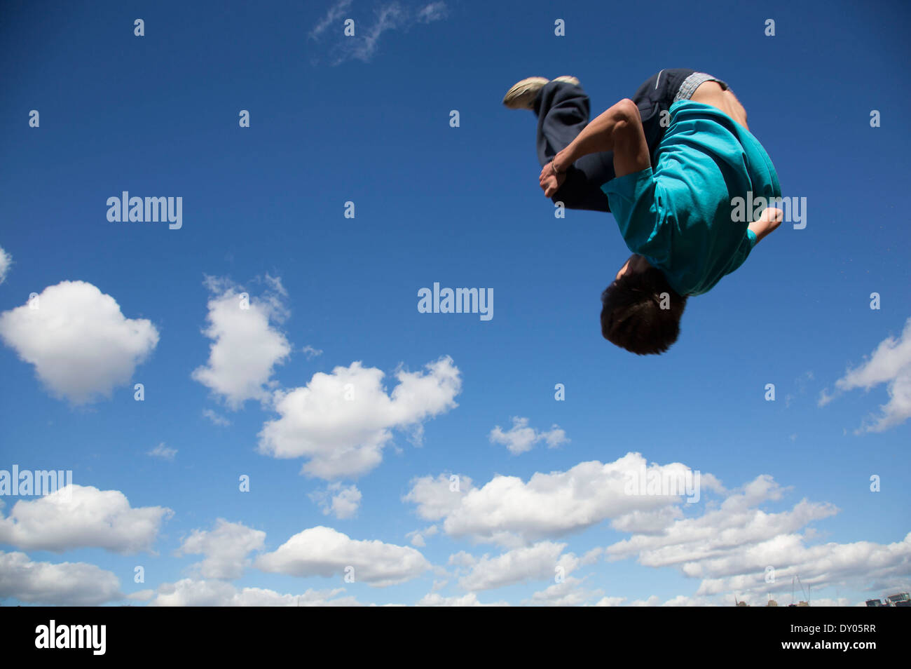 Parkour runner shows urban acrobatic skills flying upside down at the ...