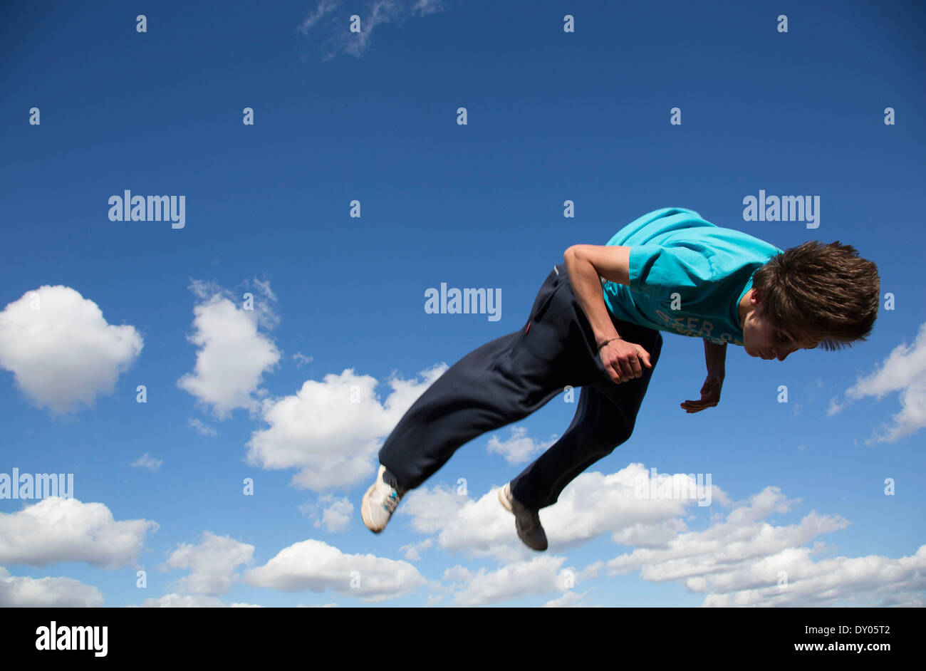Parkour runner shows urban acrobatic skills flying upside down at the ...