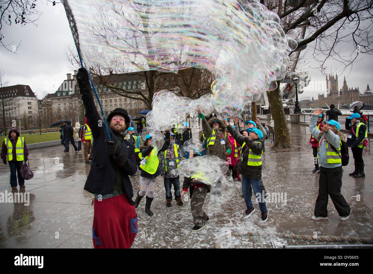 Bubble man on the Southbank riverside walkway entertaining children ...