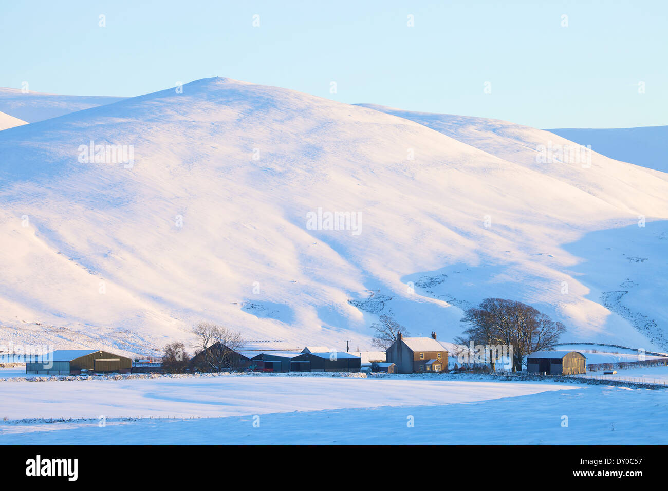 Farm in a snow covered landscape below Longlands Fell, Lake District ...