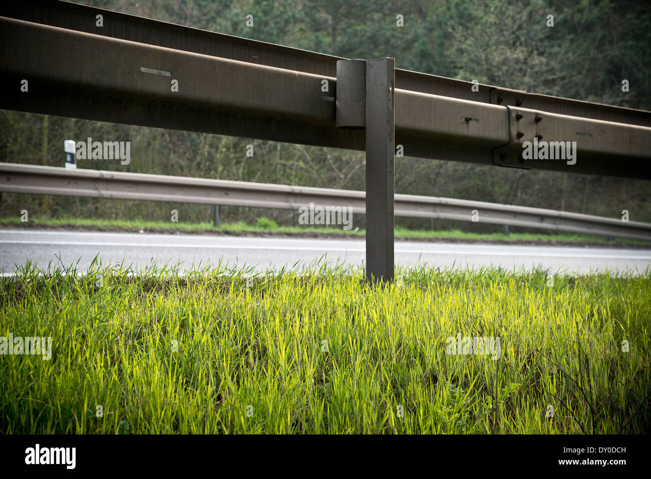 a crash barrier with roadside in the springtime Stock Photo - Alamy