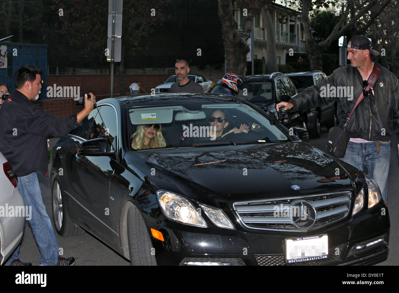Jessica Simpson's car is surrounded by photographers after leaving Saks ...