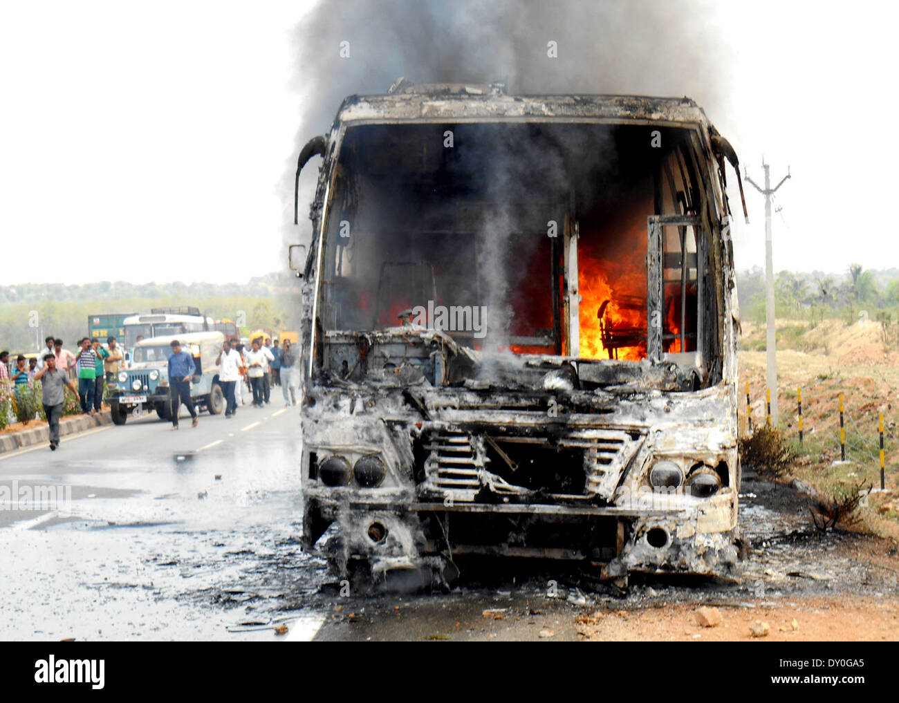 Andhra Pradesh, India. 1st Apr, 2014. Smoke and fire engulf a passenger ...