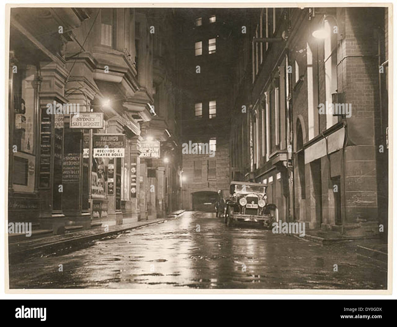 A 1930s photograph by Sam Hood showing a rainy day on Angel Place in ...