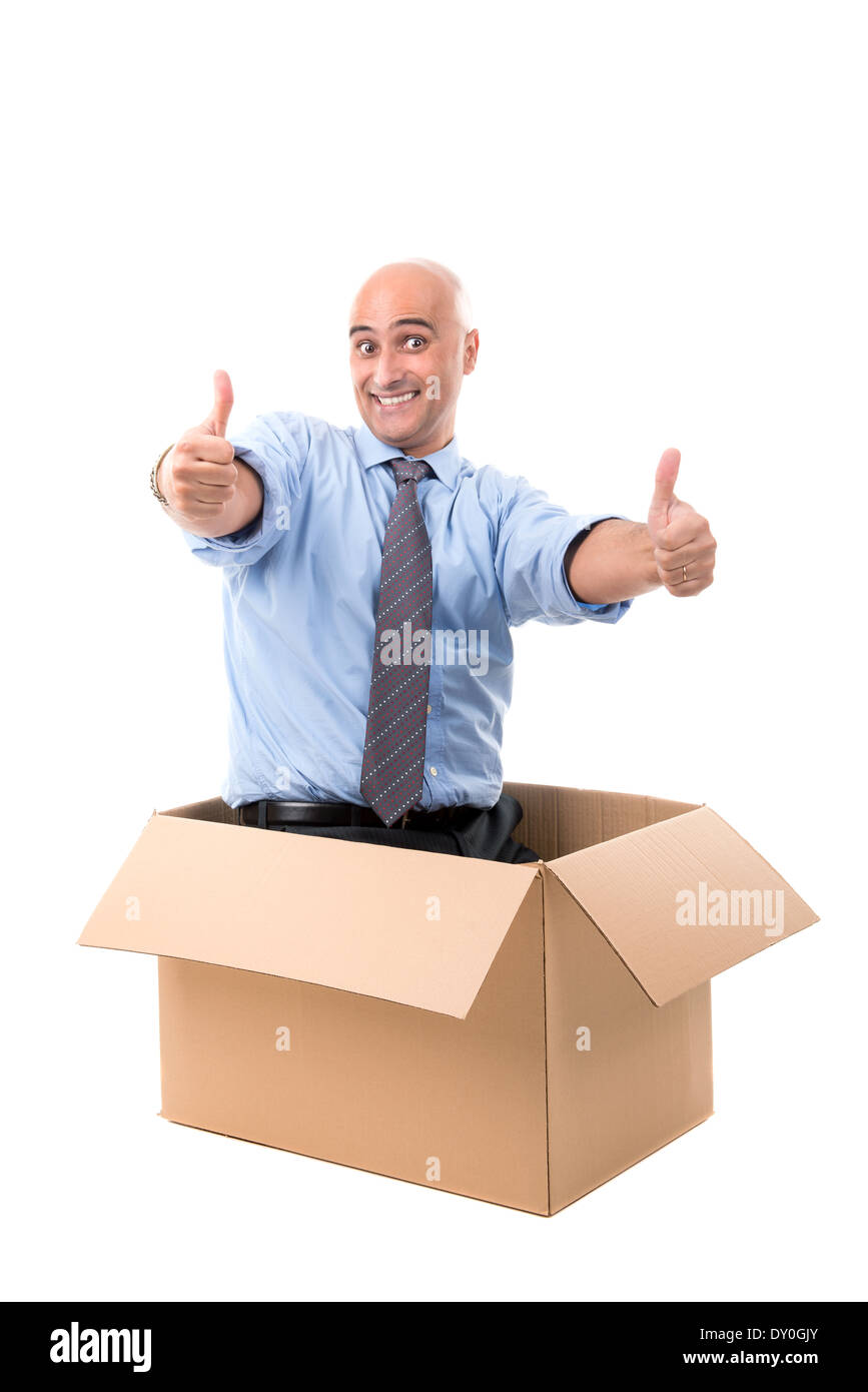 Businessman posing inside a cardboard box Stock Photo - Alamy